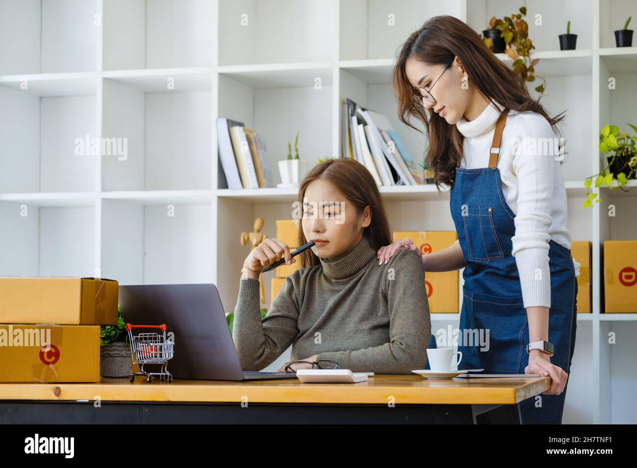 two happy women selling products online Start a small business owner ...