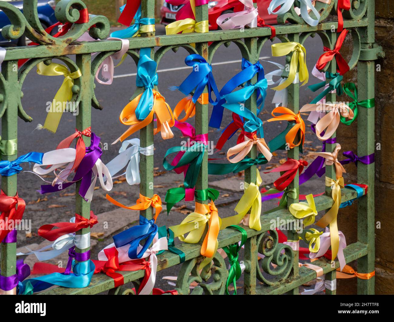 Colourful ribbons of remembrance for Remembrance Sunday on the gate and ...