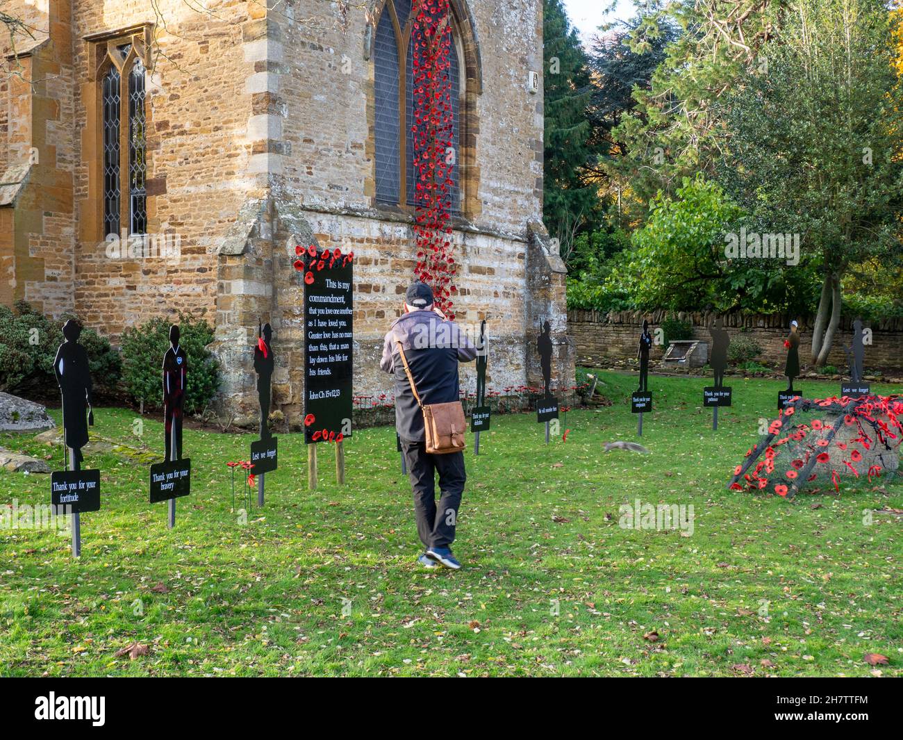Display of poppies and figure silhouettes for Remembrance Sunday ...