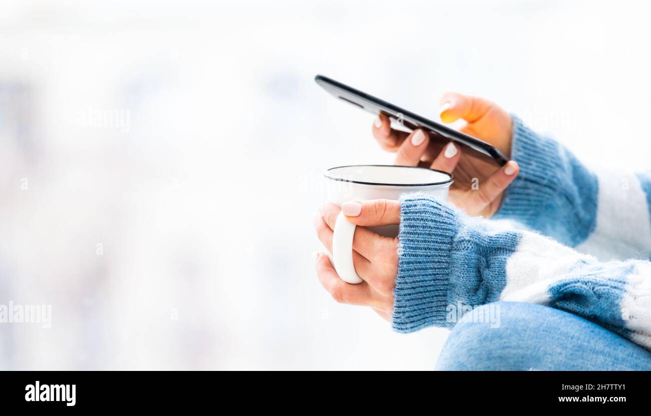 Cup and smartphone Stock Photo - Alamy