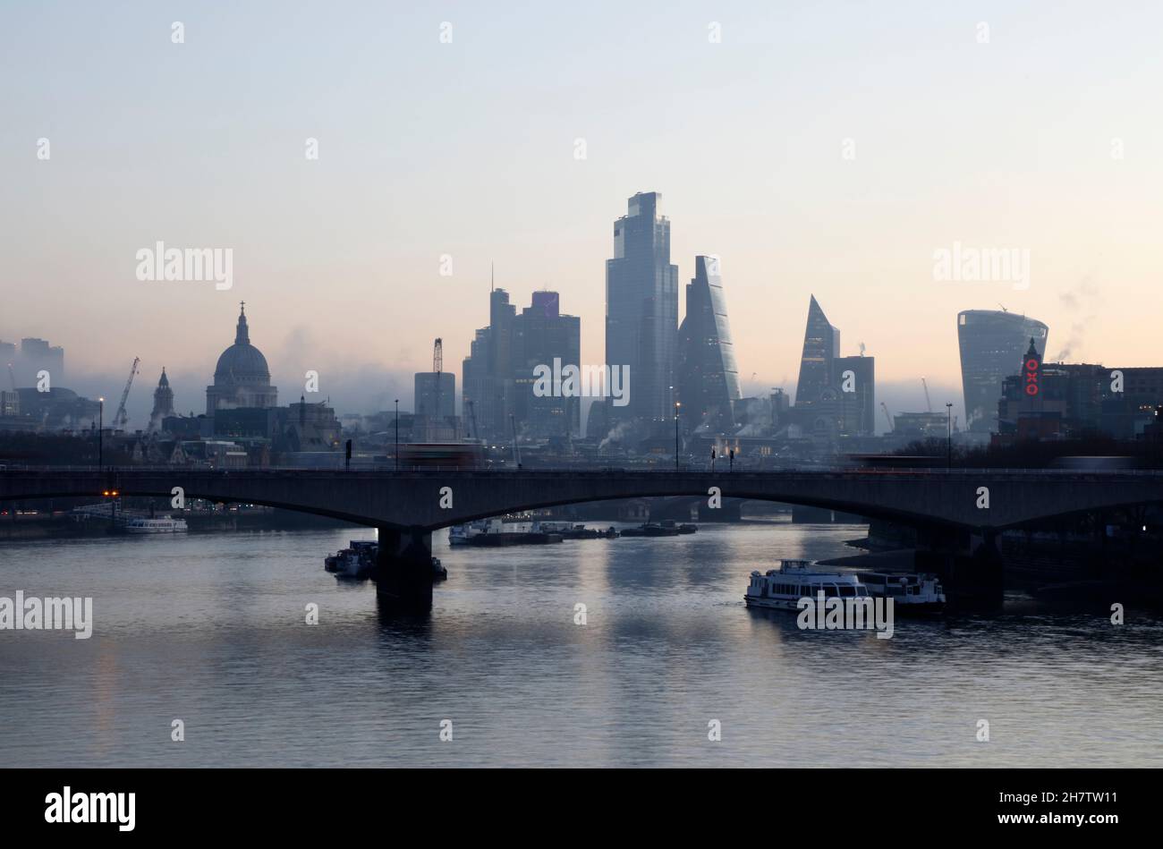 Dawn view looking downstream along the River Thames to Waterloo Bridge ...