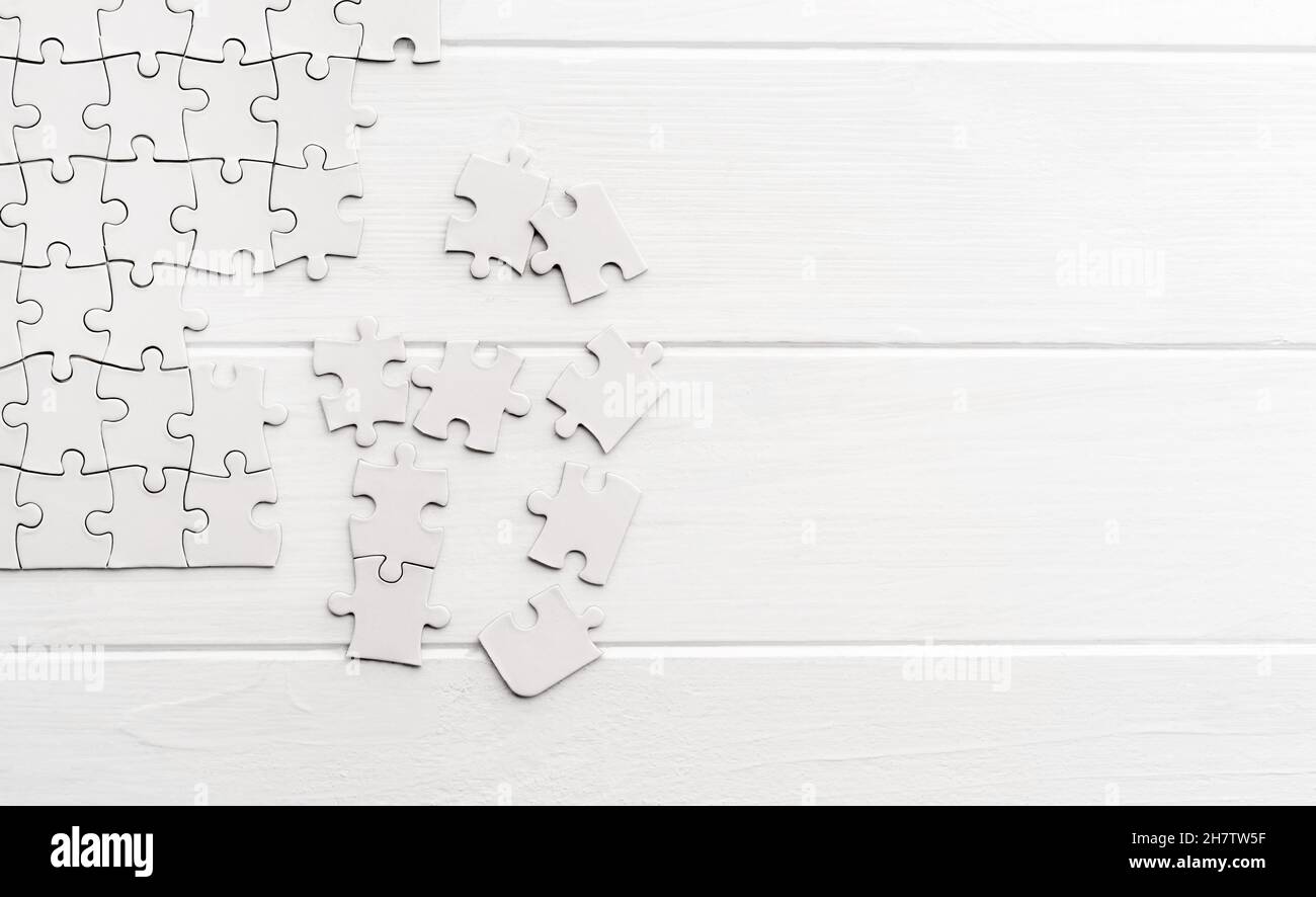 Pieces of empty jigsaw puzzle Stock Photo - Alamy