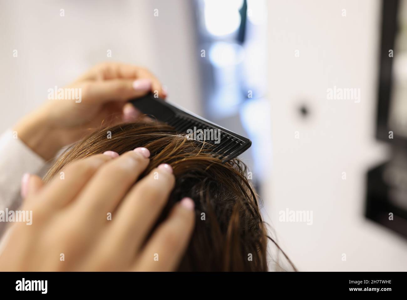 Professional hairdresser use comb for creating stylish haircut Stock ...