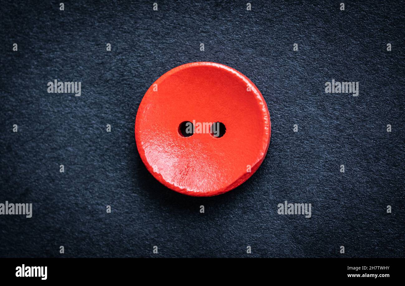 Red wooden sewing button Stock Photo - Alamy