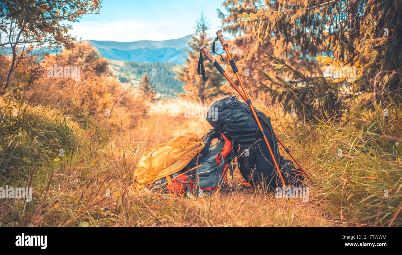 Trekking sticks and backpacks in mountains Stock Photo - Alamy