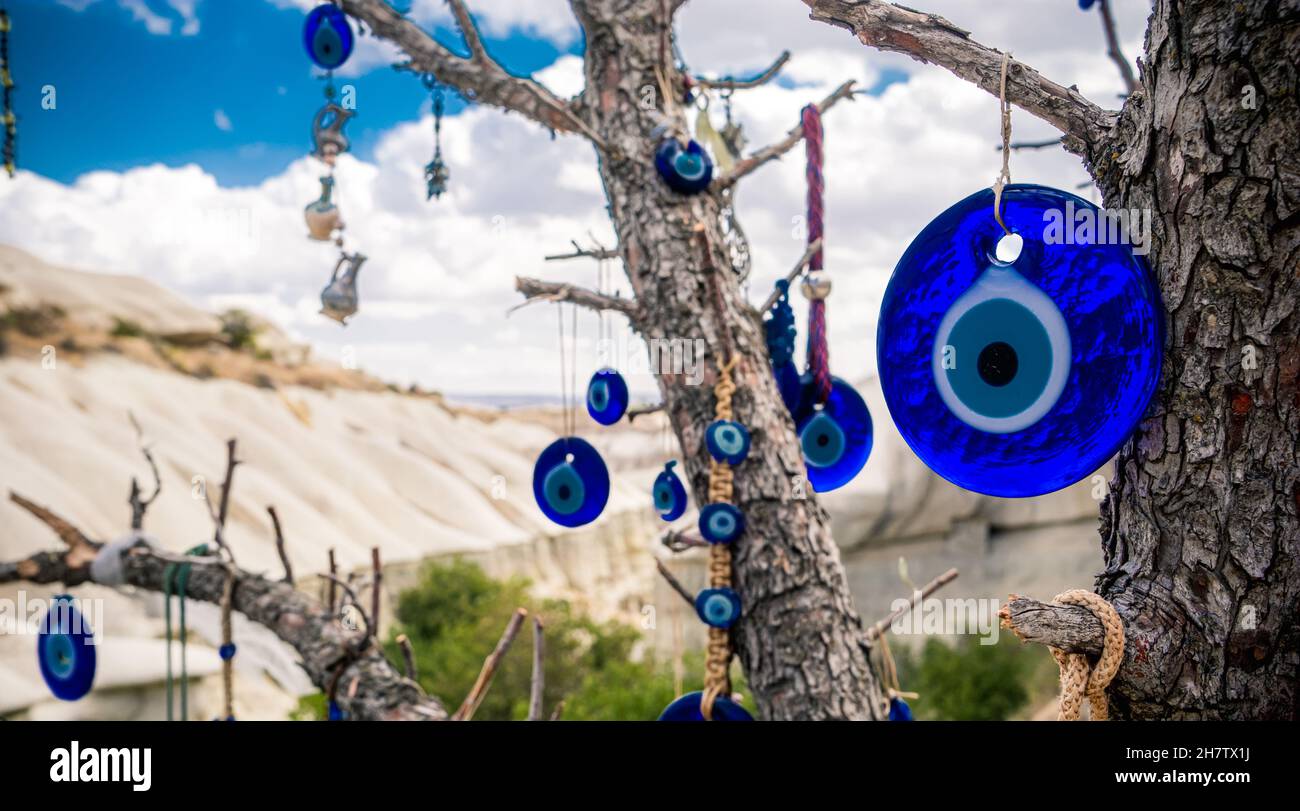 Amulets from evil eye hanging on tree Stock Photo - Alamy