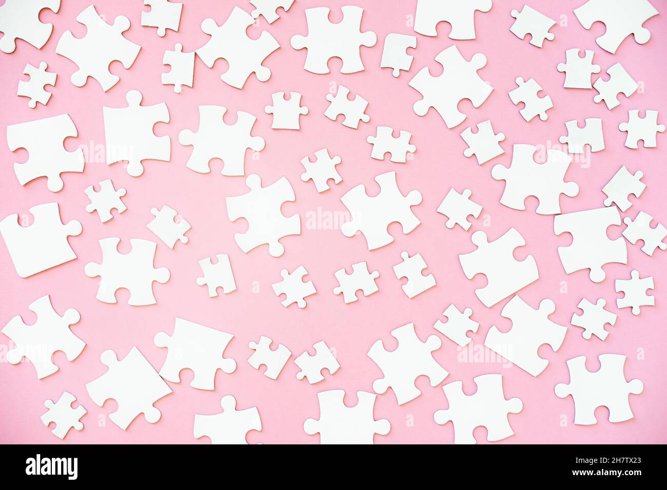 White puzzle pieces of different size Stock Photo - Alamy