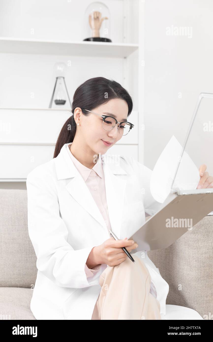 Asian Korean female psychiatric doctor in clinic Stock Photo - Alamy