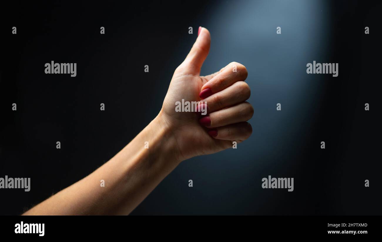 Hand shows signs with fingers Stock Photo - Alamy