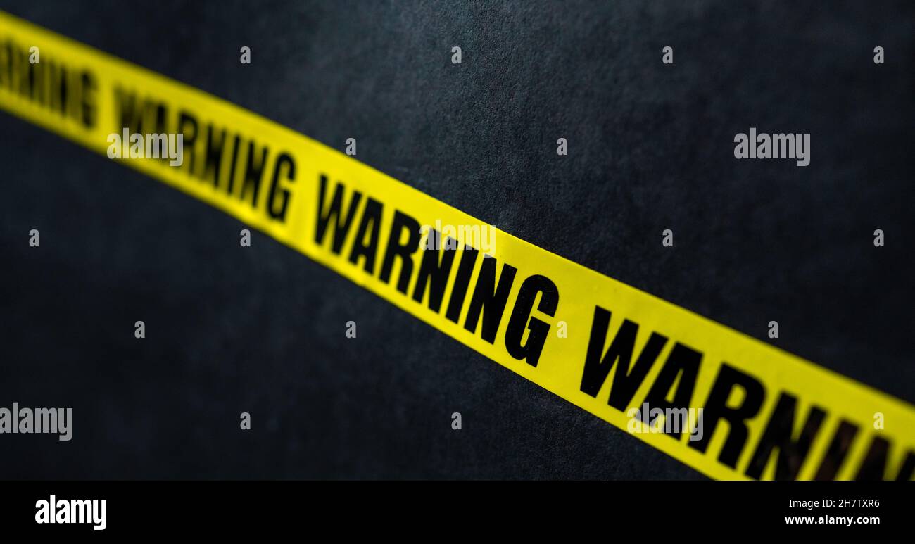 Yellow warning tape Stock Photo - Alamy