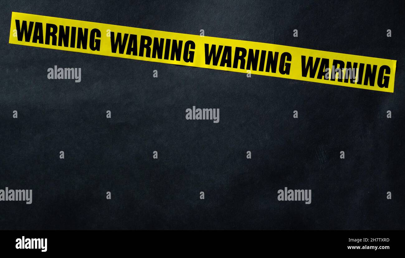 Yellow warning tape Stock Photo - Alamy