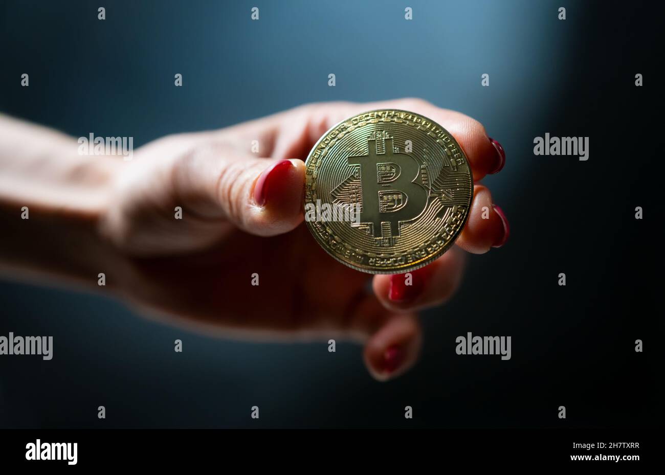 Hand holding bitcoin Stock Photo - Alamy