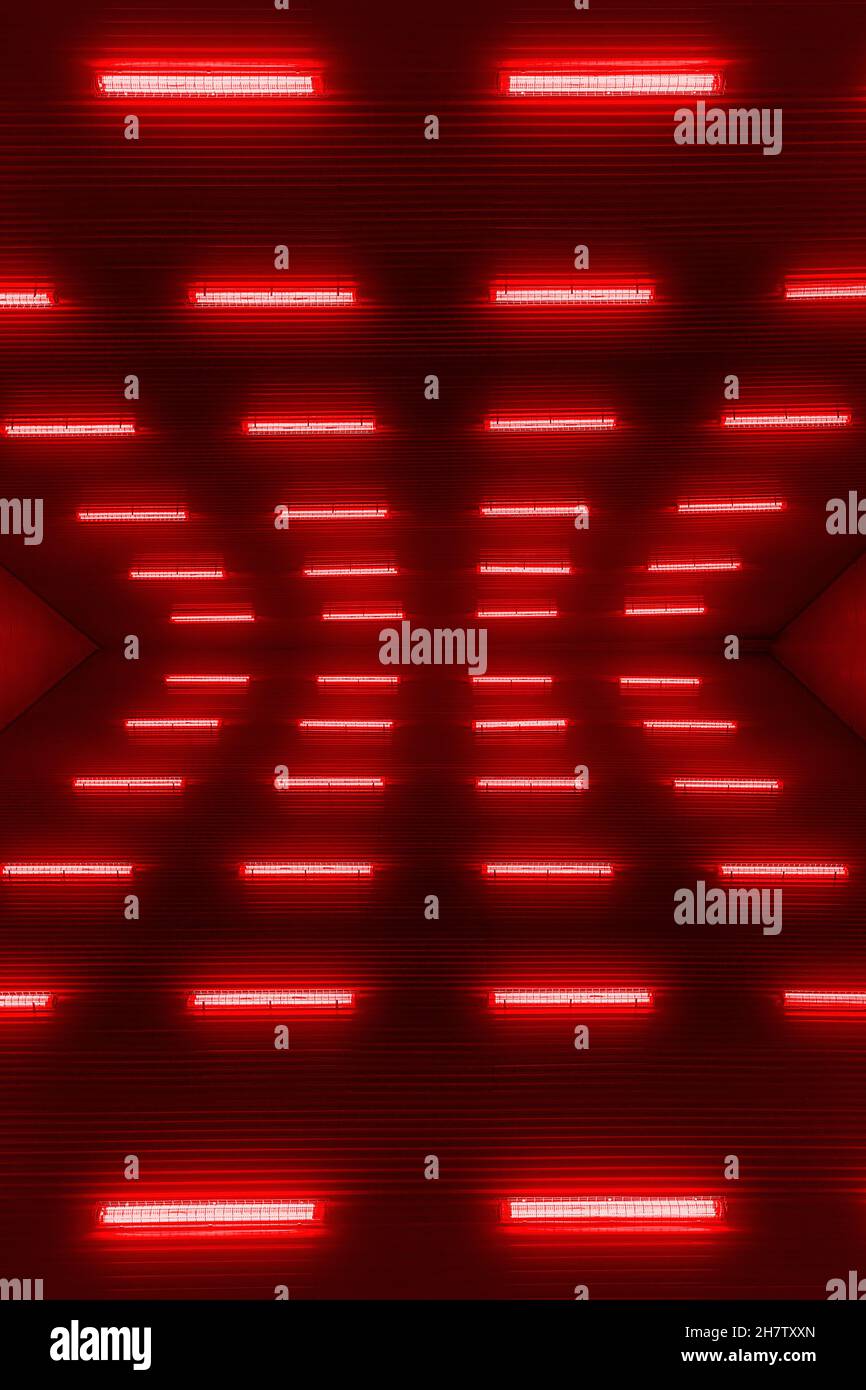 Abstract futuristic background of red color. Red glow from electric ...