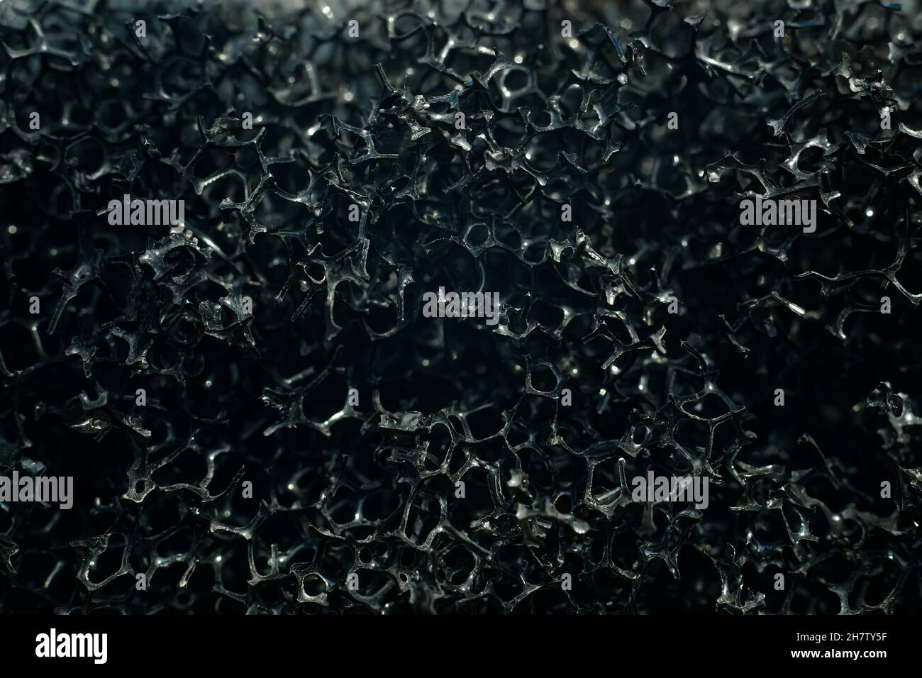 Abstract porous background. Mesh uneven surface. Macro photography ...