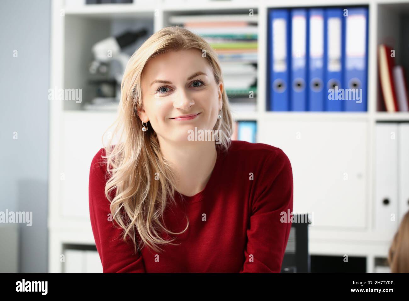Beautiful young woman office worker posing in personal cabinet Stock ...