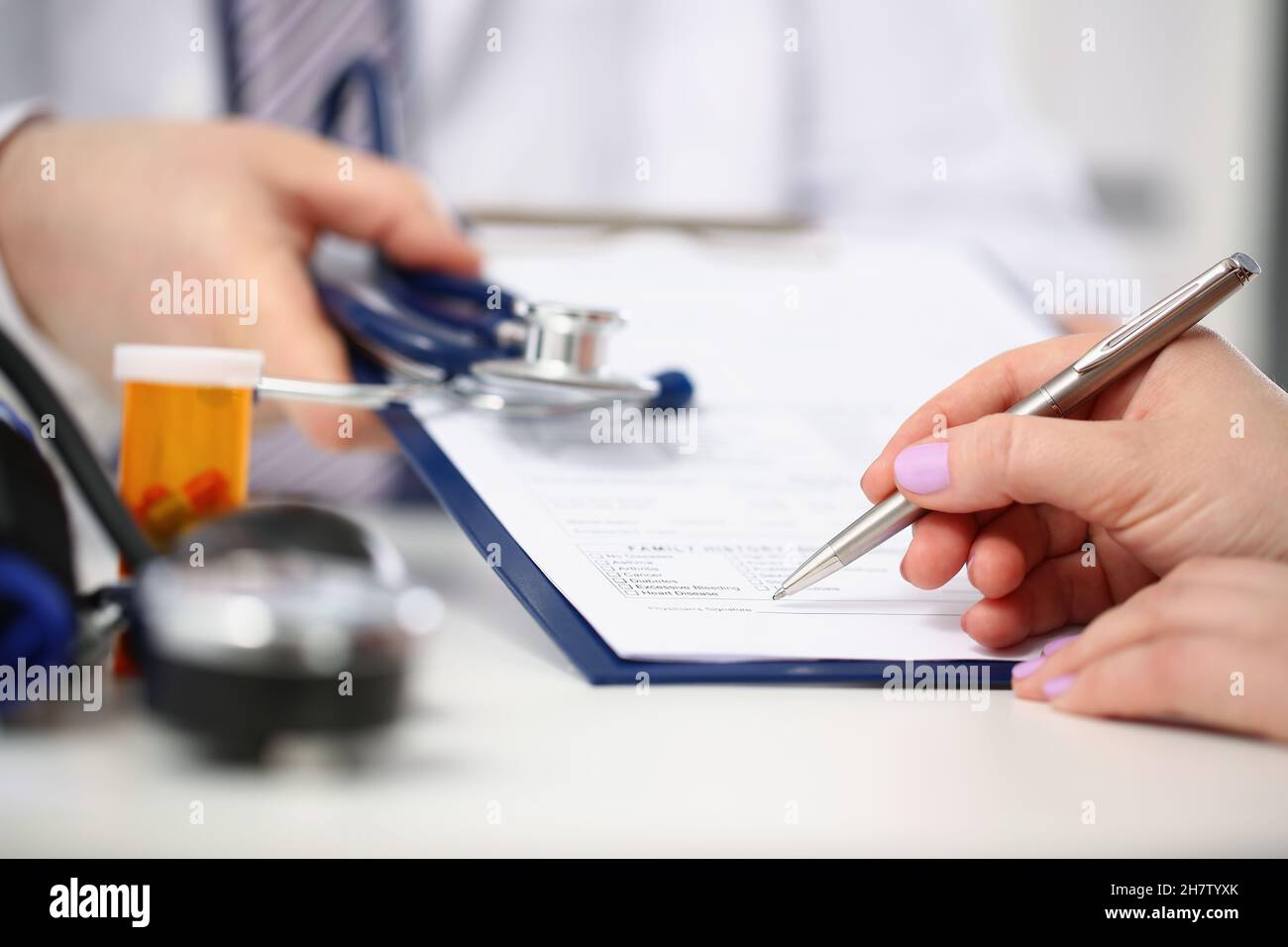 Woman put signature on paper with prescriptions for diagnostics Stock ...
