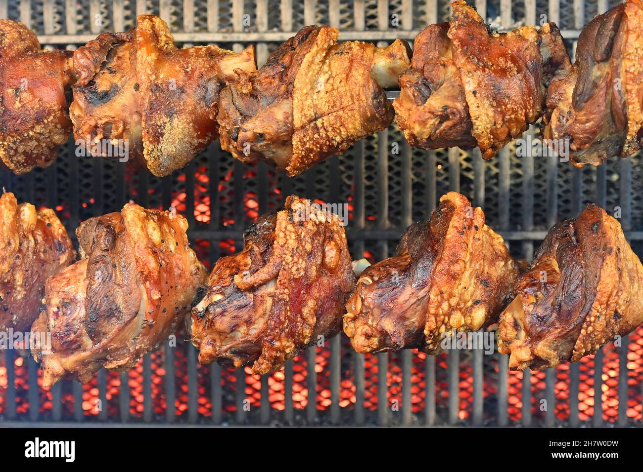 Munich, Deutschland. 24th Nov, 2021. Pork knuckles are grilled crispy ...