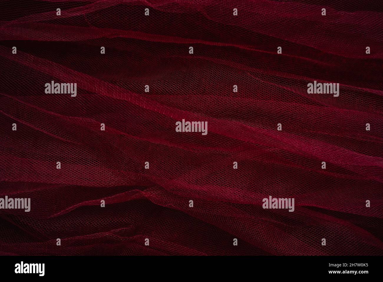 bordo red tulle mesh layers textured background for holiday season ...