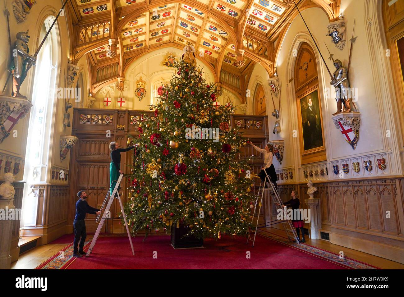 Members of the Royal Collection Trust staff put the finishing touches ...