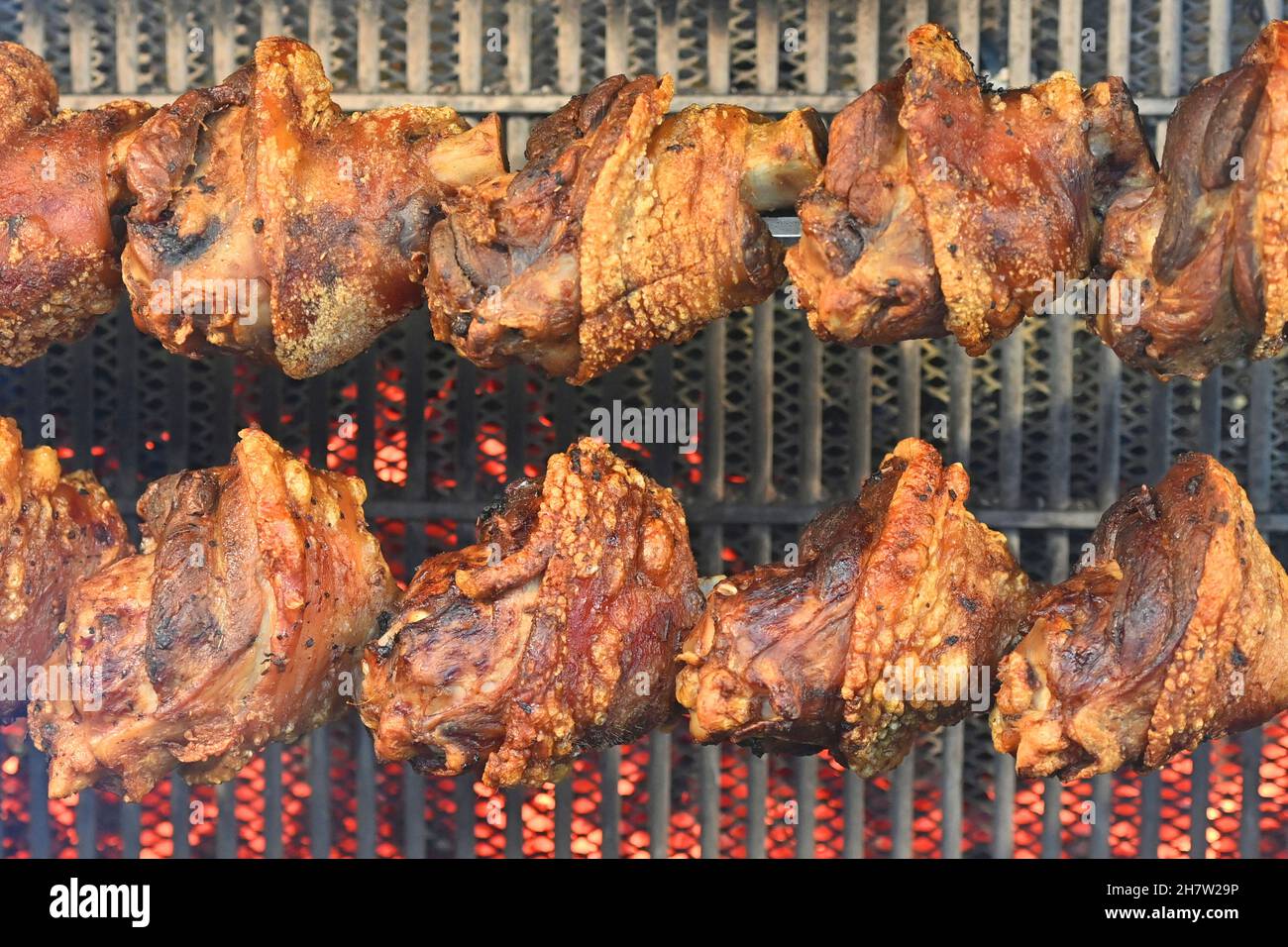 Munich, Deutschland. 24th Nov, 2021. Pork knuckles are grilled crispy ...