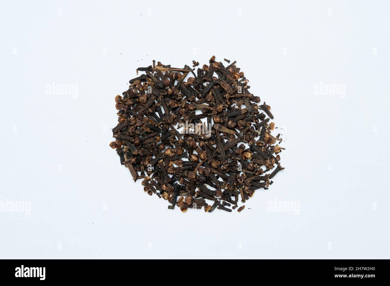 Closeup of fresh cloves isolated on white background with free space ...