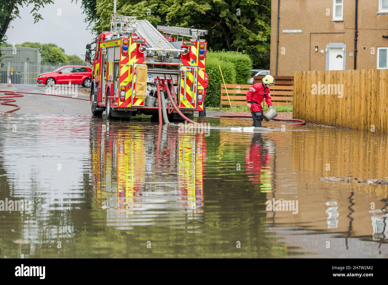 Broomfield Crescent in Edinburgh is flooded after heavy rainfall ...