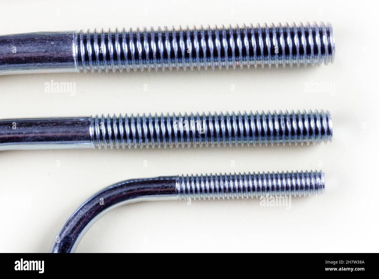 big metal screw on a white background Stock Photo - Alamy