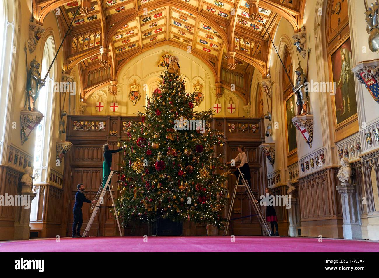 Members of the Royal Collection Trust staff put the finishing touches ...