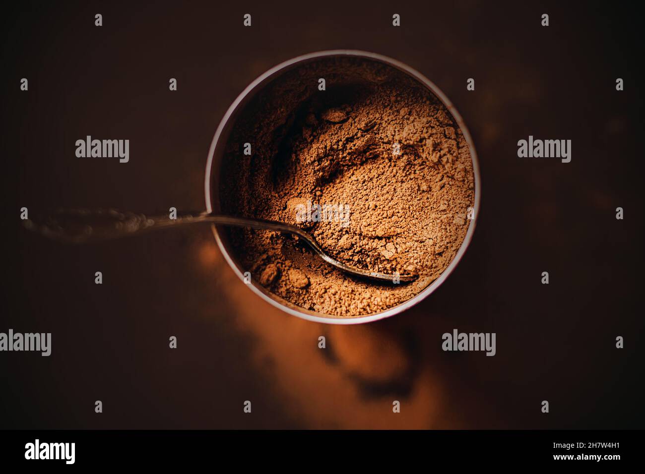 Top view of a jar filled with delicious aromatic natural cocoa powder ...
