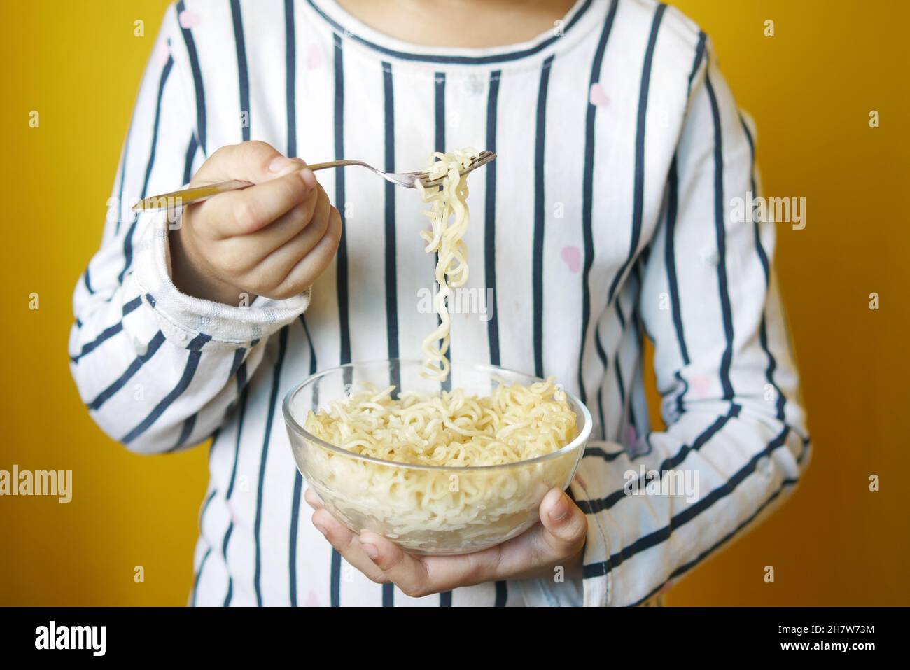 Child holding a food bowl hi-res stock photography and images - Alamy