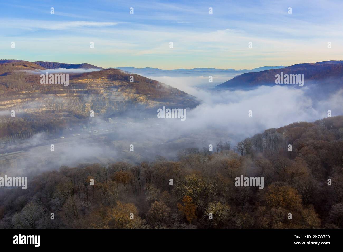 Mountain peaks in morning fog over mountains Stock Photo - Alamy