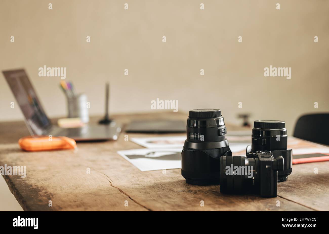 Shot of a photographer's workstation at home. Still life shot of a desk ...