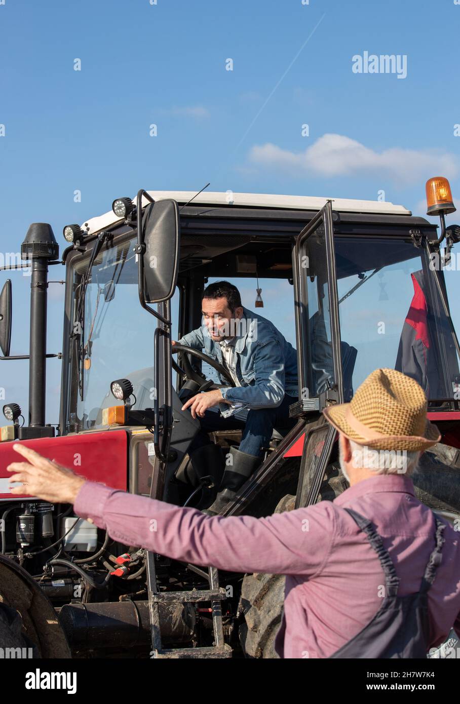 Senior farmer driving tractor hi-res stock photography and images - Alamy