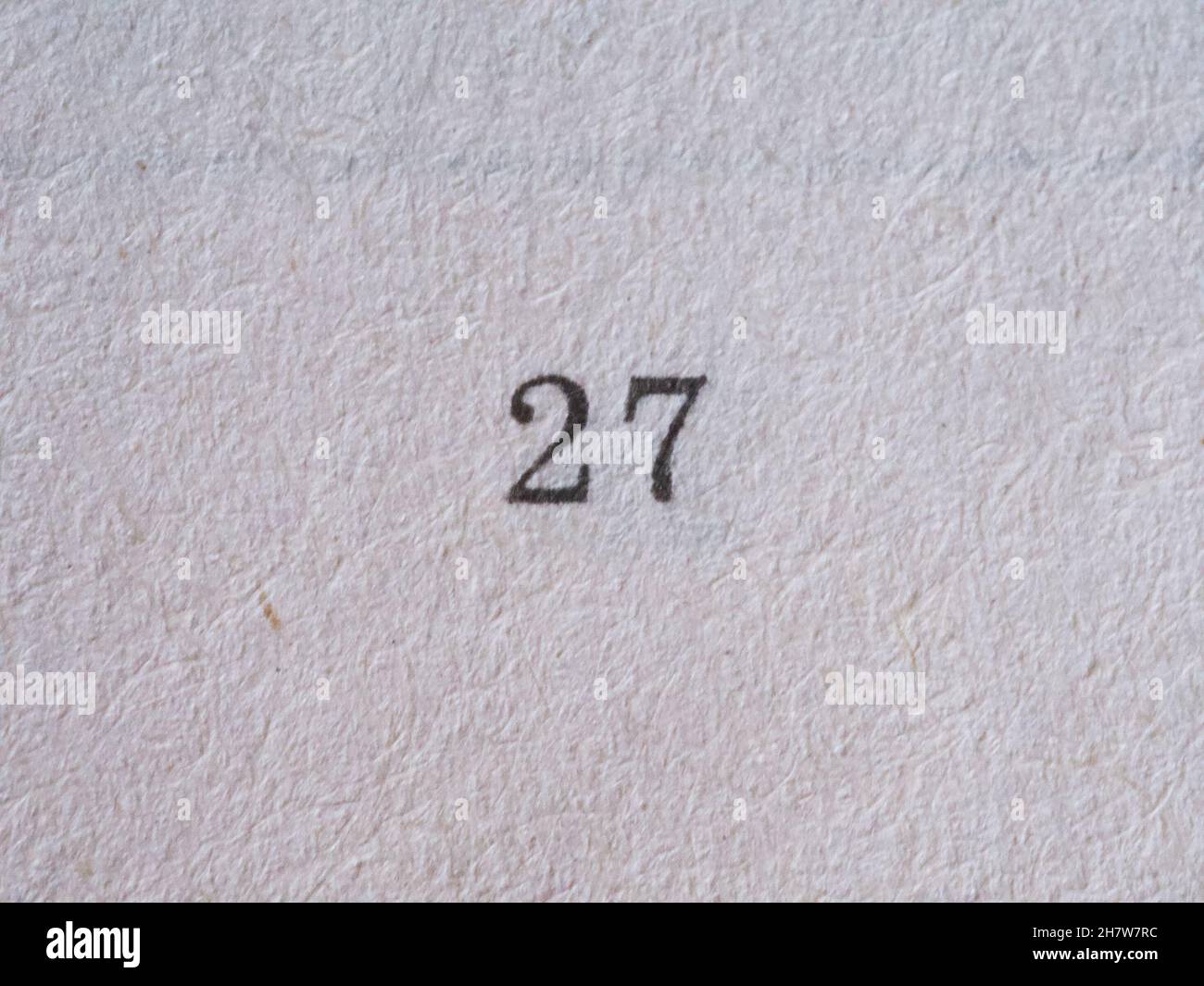The number 27 printed on a piece of paper. Paper texture Stock Photo ...