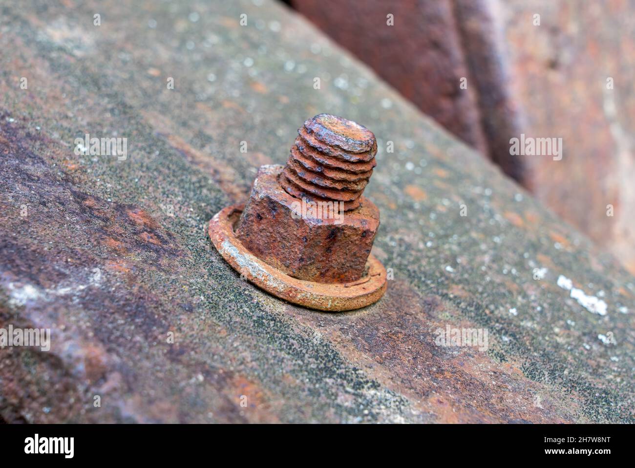 A rusty nut with a waher on a heavy metal Stock Photo - Alamy