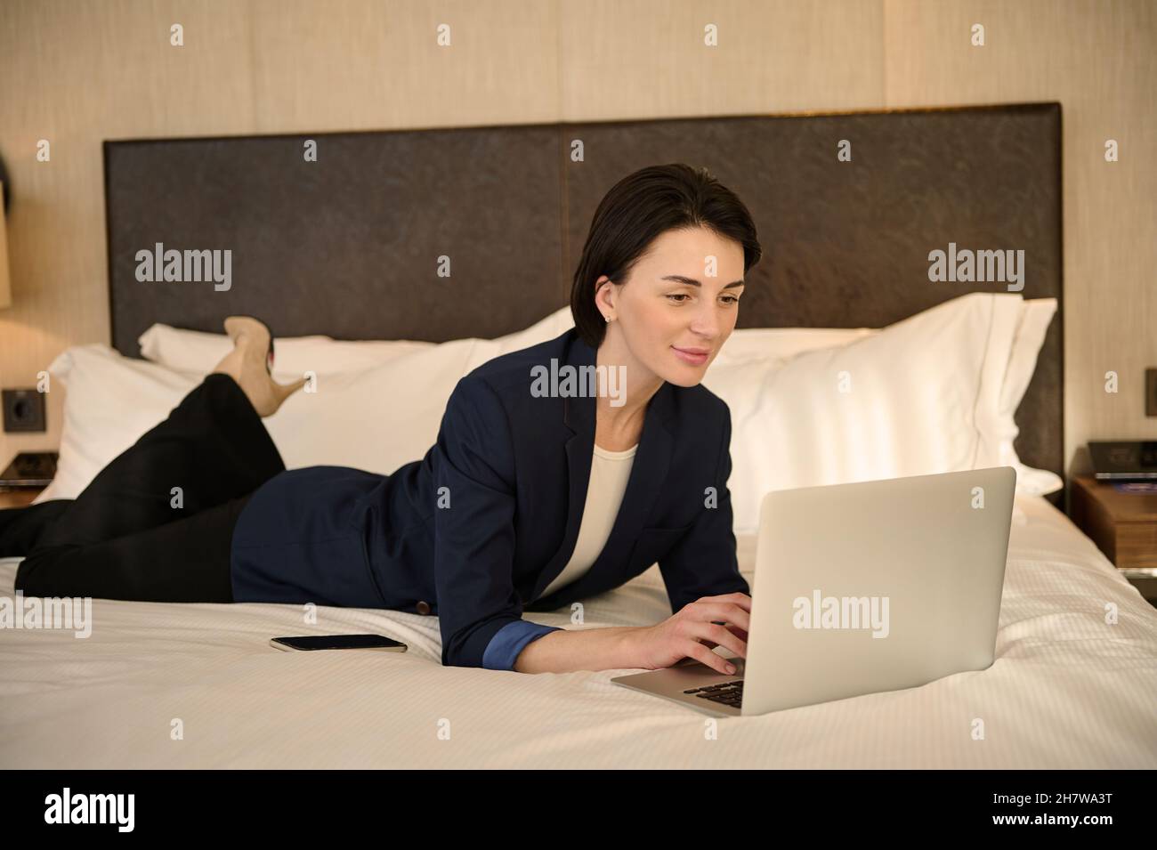 Beautiful successful young Caucasian business woman relaxing after work ...