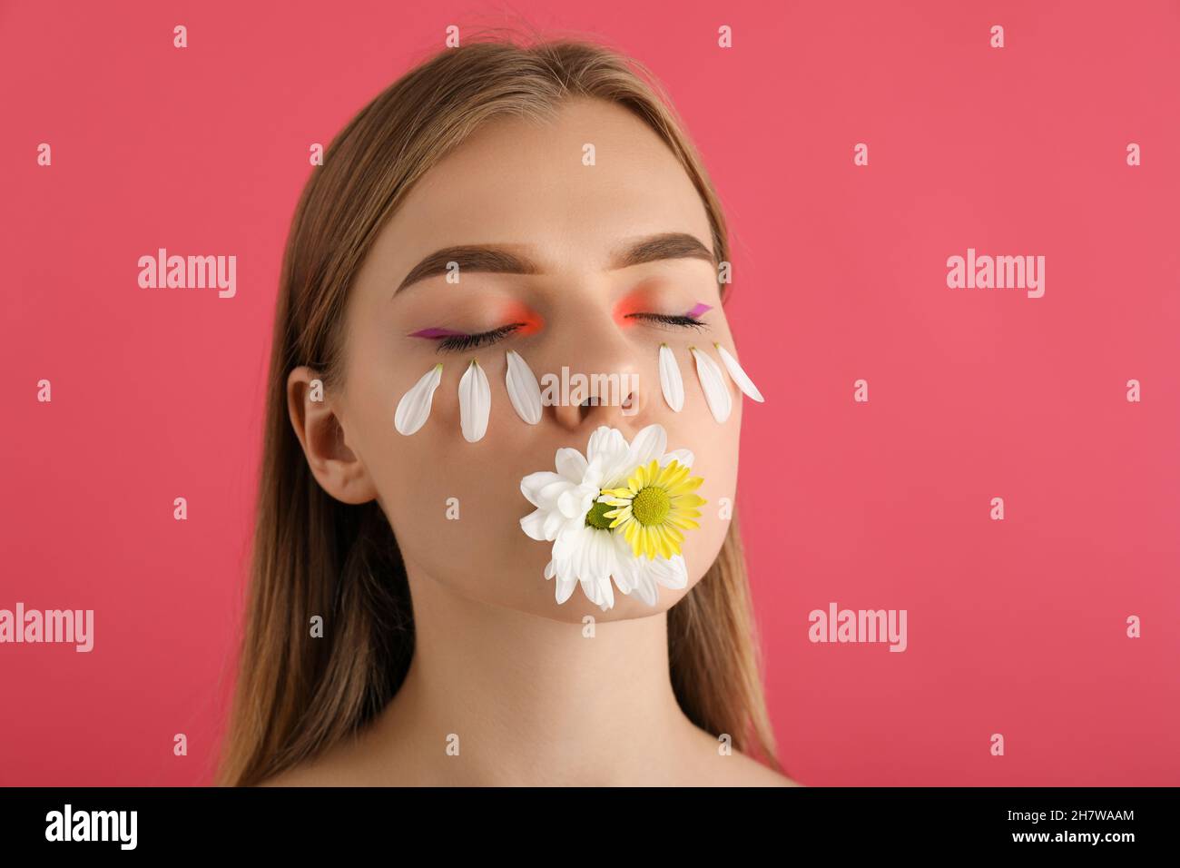Beautiful model girl with flowers on pink background Stock Photo - Alamy