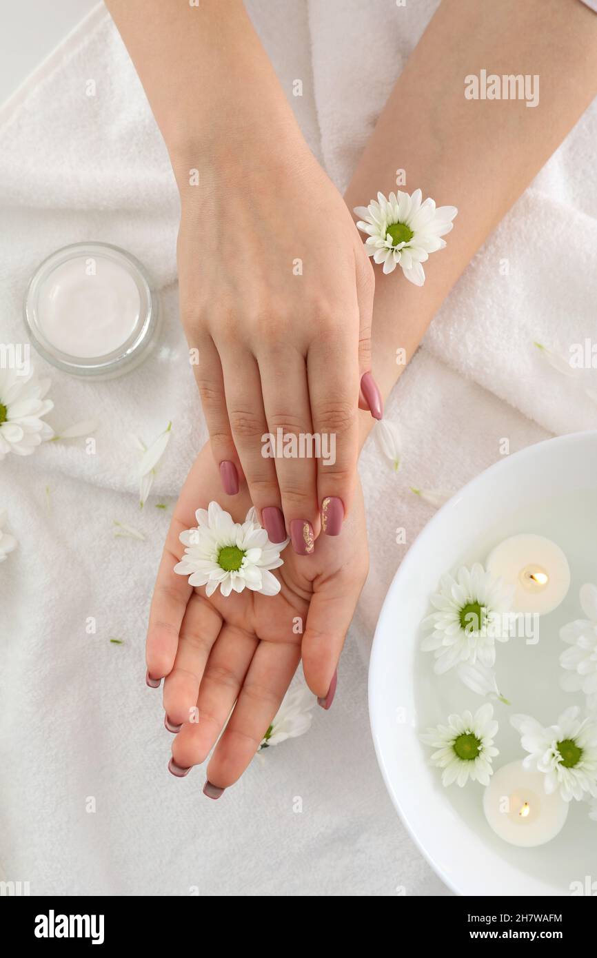 Concept of hand care with cosmetics on white towel background Stock ...
