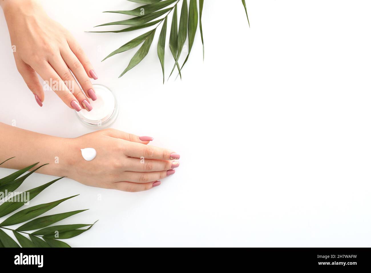 Concept of hand care with cosmetics on white background Stock Photo - Alamy