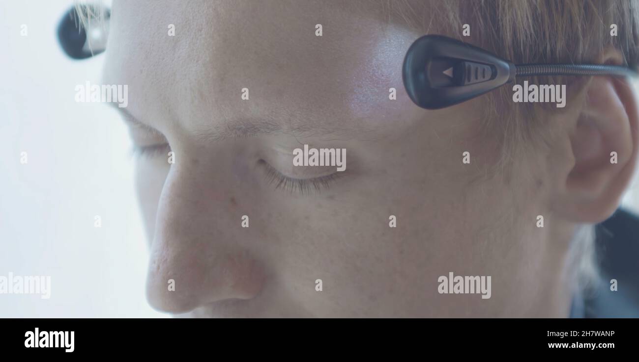 Pulse sensors on head. Stock. Close-up of man wearing flashlights ...