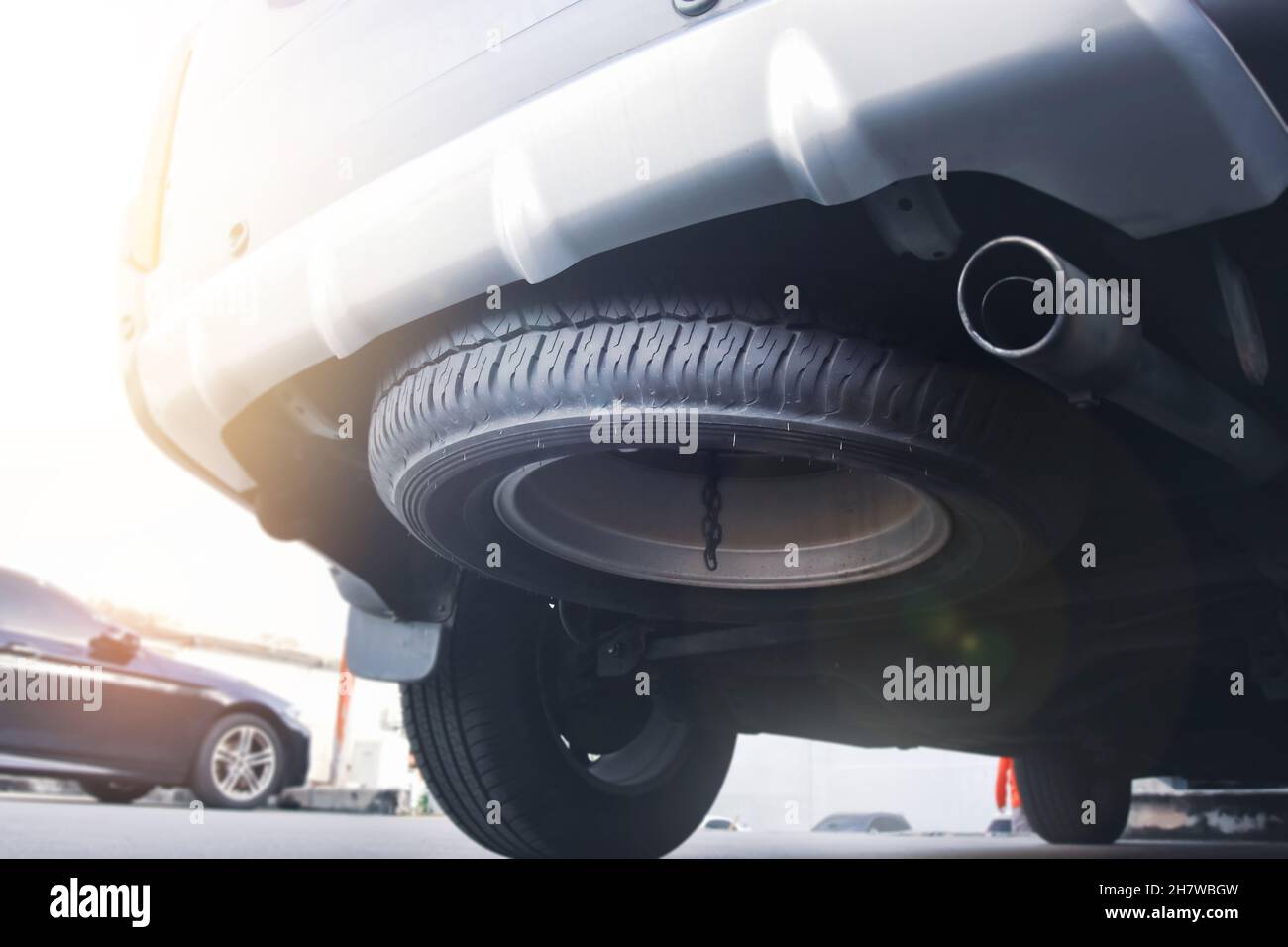 The SUV car spare wheel is hidden beneath the vehicle (Sport Utility ...