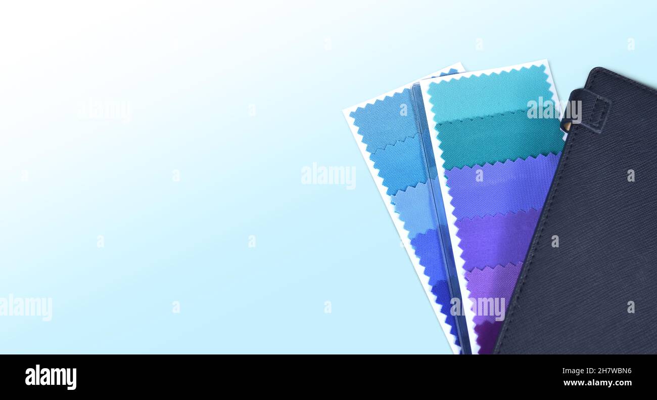 Textile color charts with horizontal copy space on blue background ...