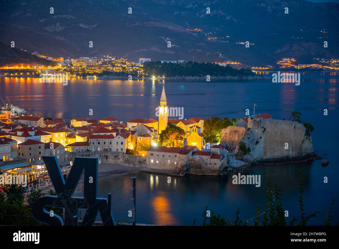 Night view of Budva old town with seaview and evening lights from ...