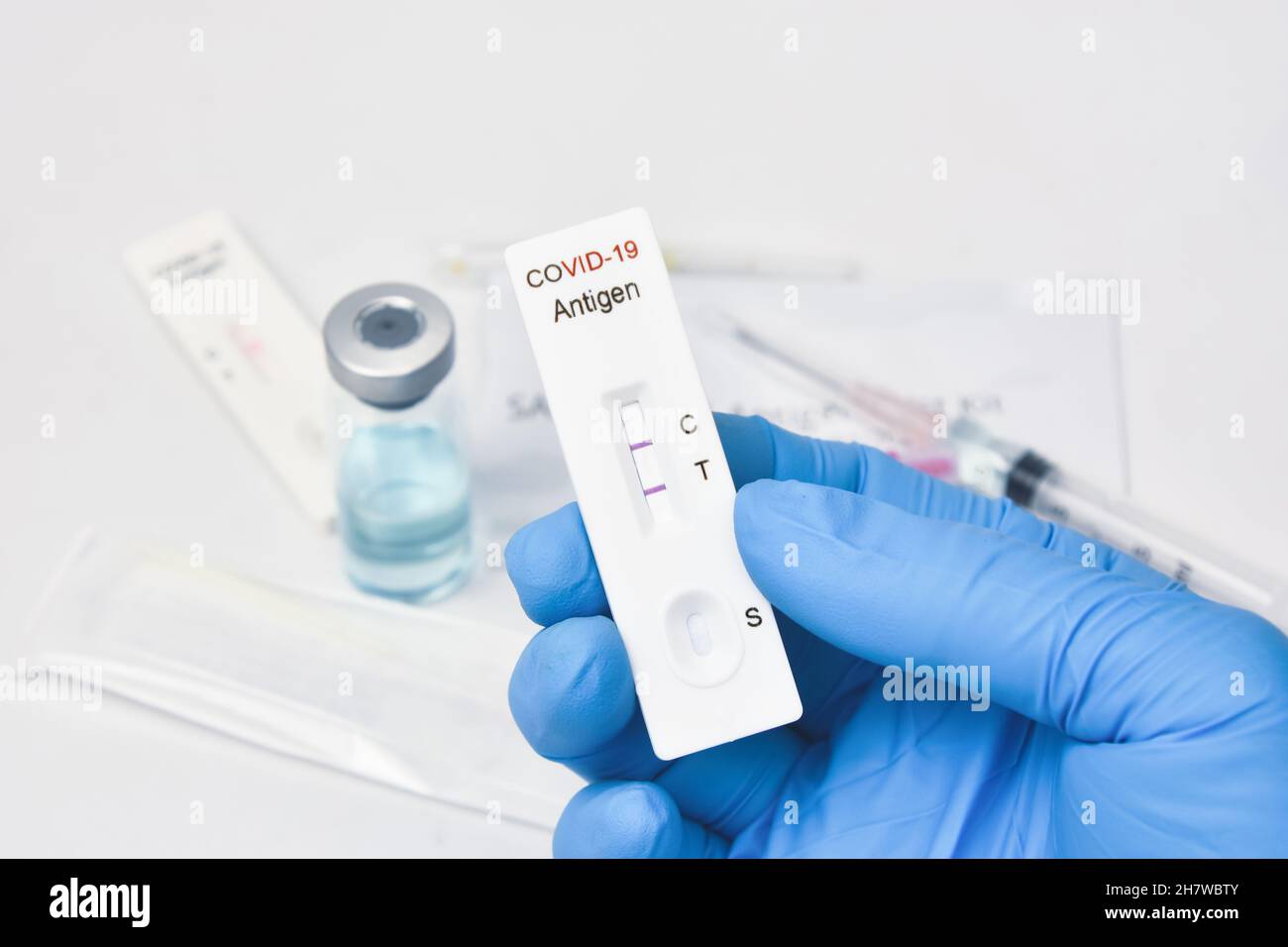 The doctor displays a Covid-19 positive result cassette from a rapid ...