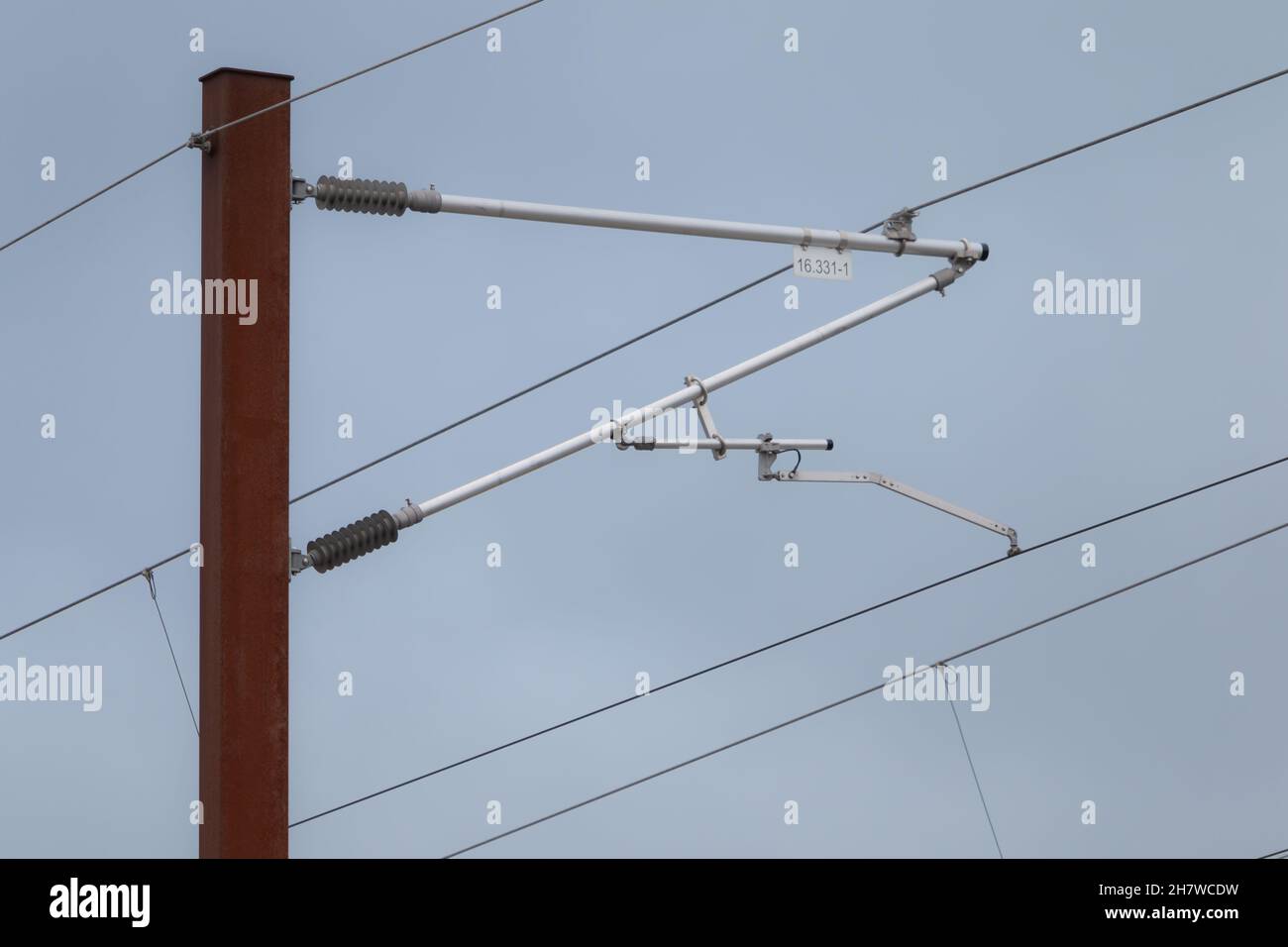 Overhead live electric railway train power supply Stock Photo - Alamy