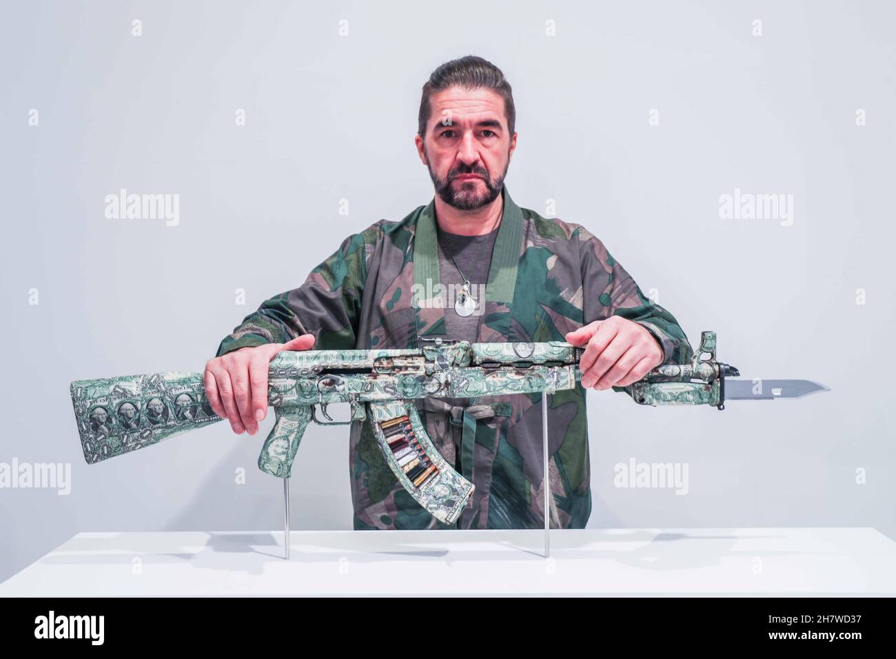 Ak 47 wrapped up in dollar bills hi-res stock photography and images ...