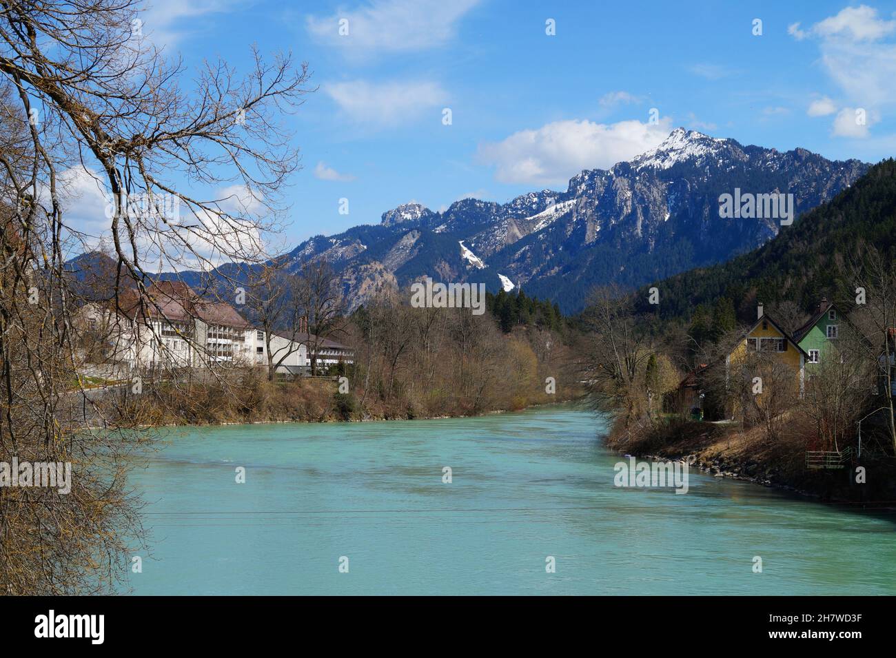 old German town Fussen on the turquoise Lech river with the snowy Alps ...