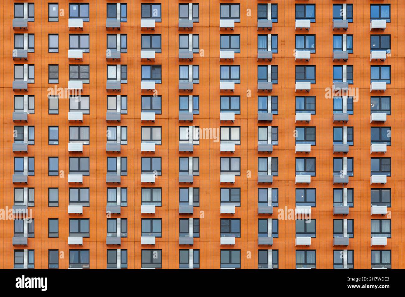 Background image - orange wall of a multi-storey building Stock Photo ...
