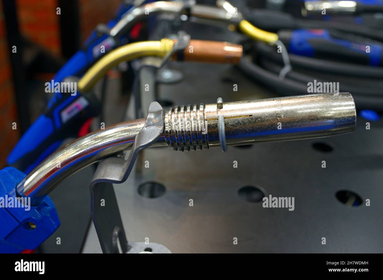 Man hand holding welding semi automatic gun for welder Stock Photo - Alamy