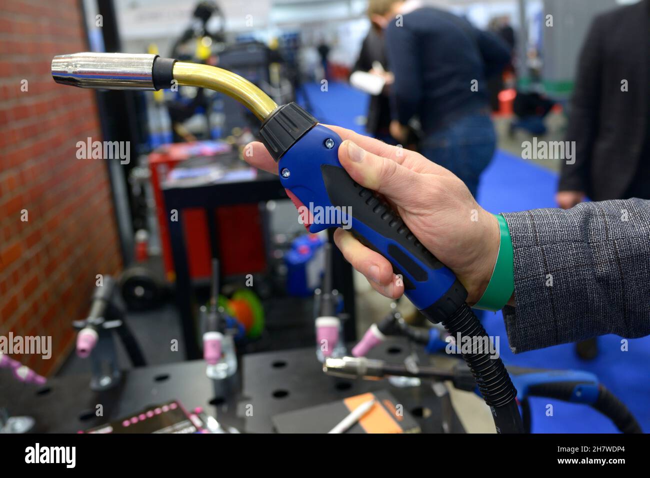 Man hand holding welding semi automatic gun for welder Stock Photo - Alamy